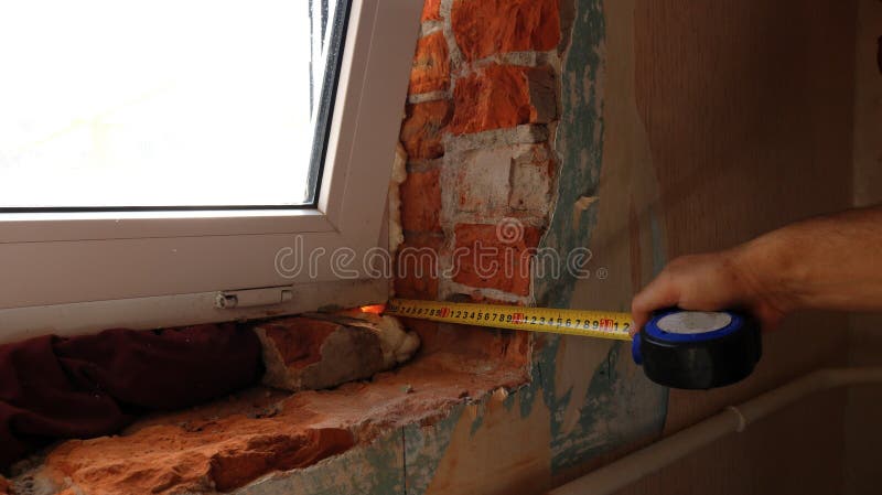 Measuring the Depth of a Window Opening with a Tape Measure for Making ...