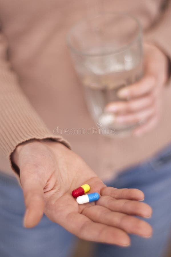 Taking medication stock image. Image of prescription, hand - 9097373