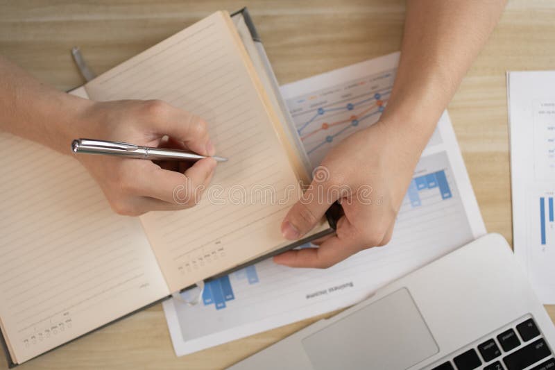 Young Man S Hand Writing an Important Message in Notebook ...