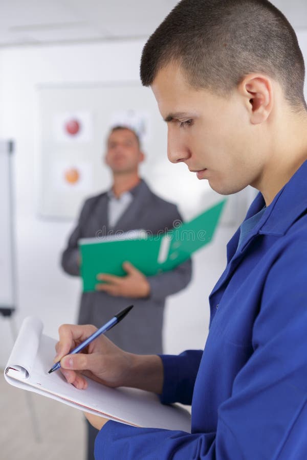 Taking notes during class stock photo. Image of work - 95336282
