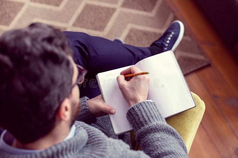Top View of a Serious Smart Man Writing Stock Photo - Image of note ...