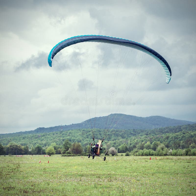 Taking off the paraglider. stock image. Image of freedom - 64069399