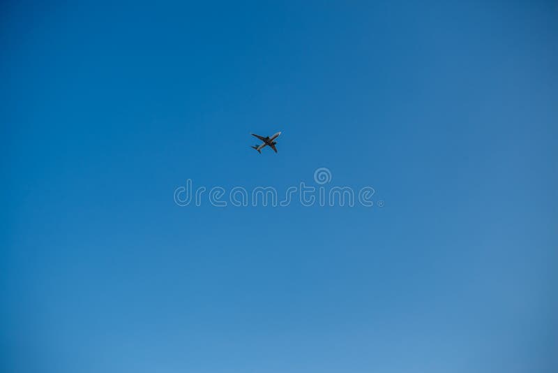 Taking Off the Plane . View from Below on a Blue Sky Background Stock ...