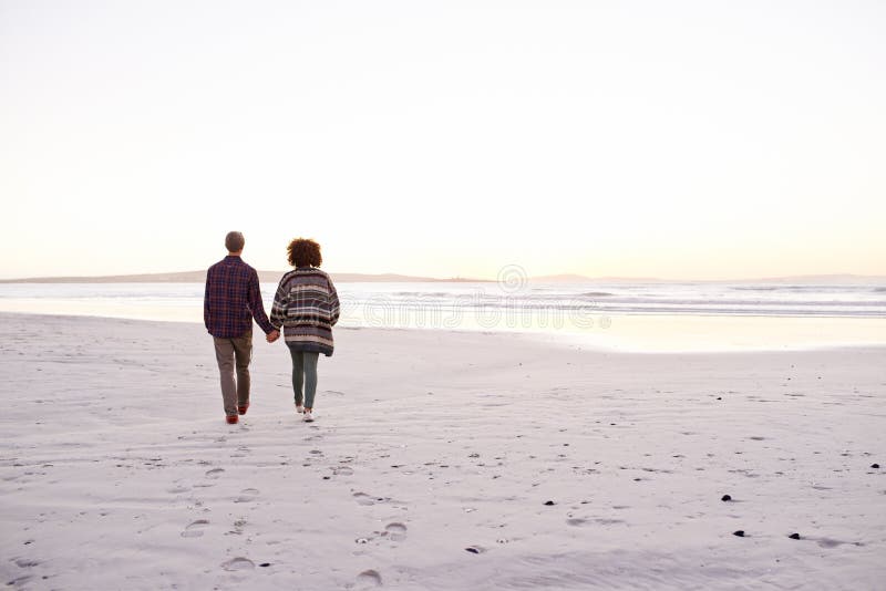 Taking it One Step at a Time. a Young Couple Enjoying a Walk on the ...