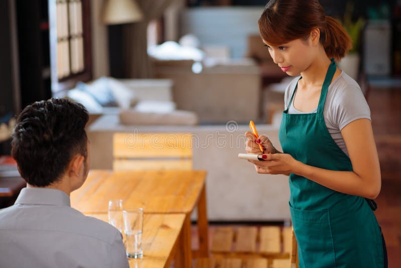 Waitress taking the order stock photo. Image of writing - 153350212