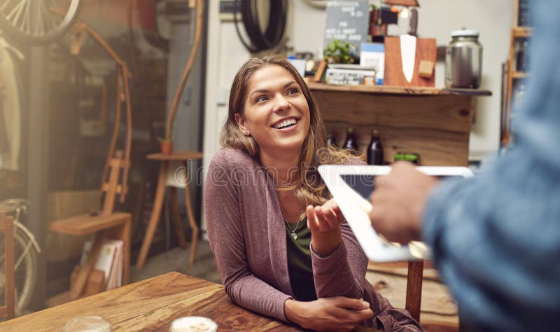 Taking Orders the Wireless Way. a Young Woman Placing Her Order with a ...
