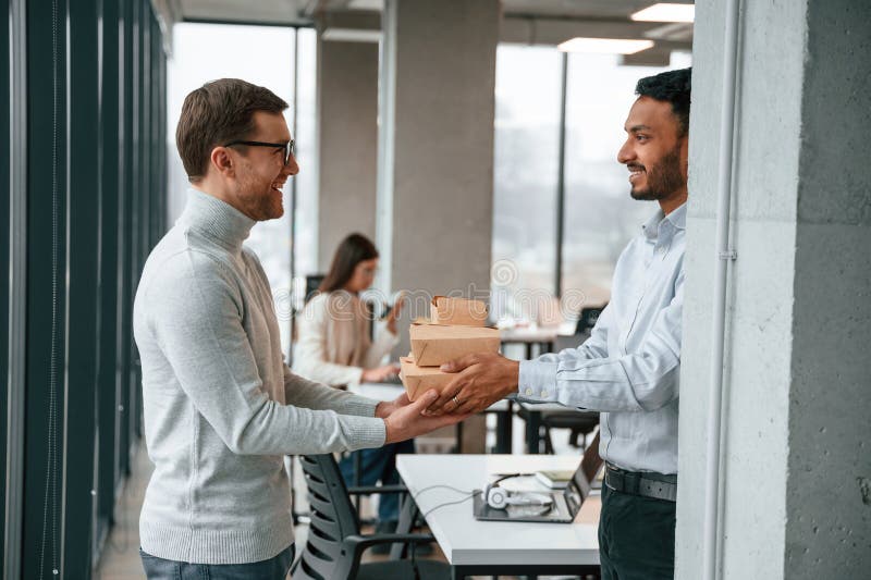 Taking the Paper Eco Boxes. Men and Woman are Working in the Office ...