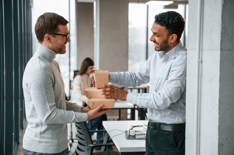 Taking the Paper Eco Boxes. Men and Woman are Working in the Office ...