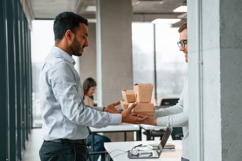 Taking the Paper Eco Boxes. Men and Woman are Working in the Office ...