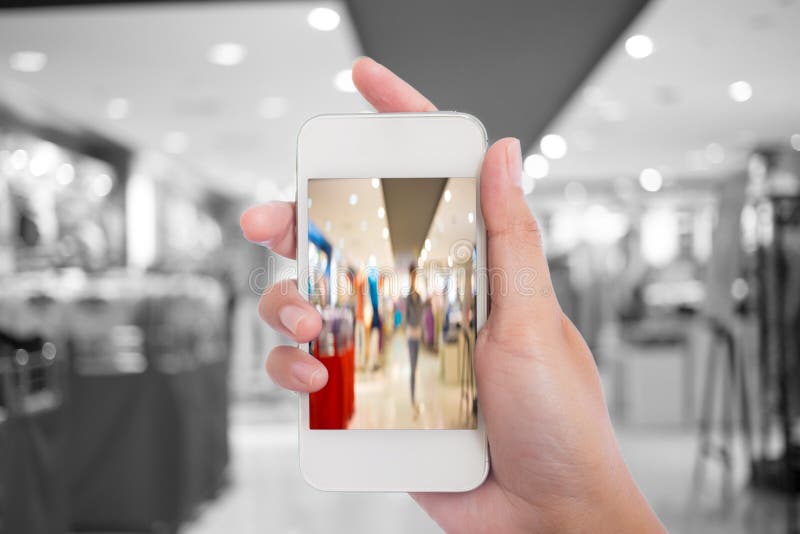 Taking a Picture with a Smart Phone in Shopping Mall. Stock Image ...