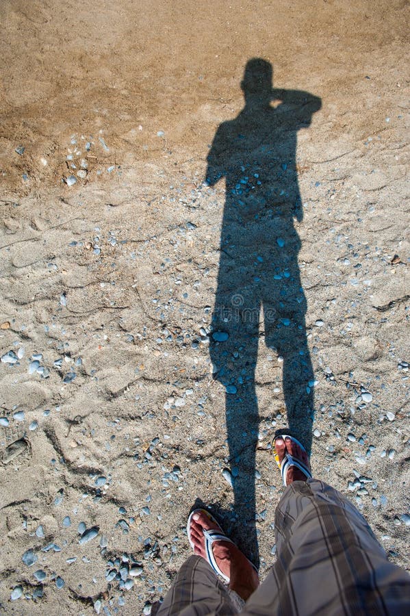 Taking Pictures of His Shadow on the Beach Stock Image - Image of ...
