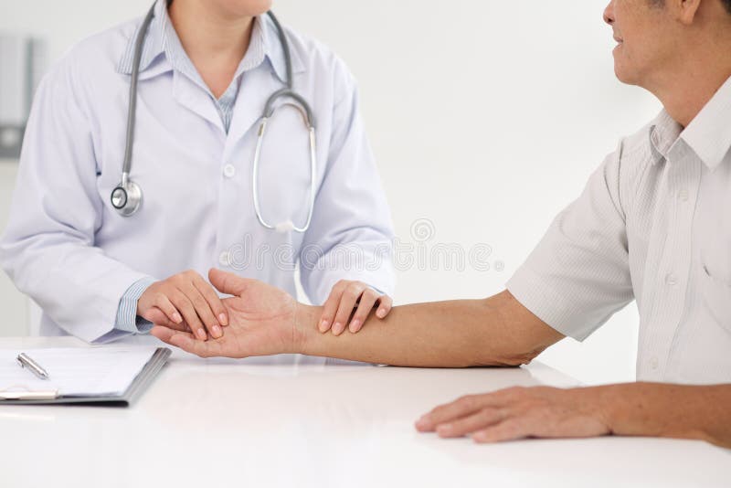 Taking pulse stock photo. Image of senior, sitting, healthcare - 51359888