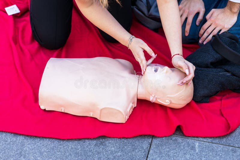 Taking a Pulse or Heart Rate during CPR and First Aid Stock Image ...