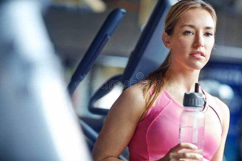 Taking a Quick Break between Workouts. a Young Woman Resting after Her ...