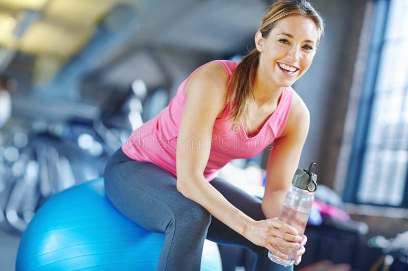 Taking a Quick Break between Workouts. a Young Woman Resting after Her ...