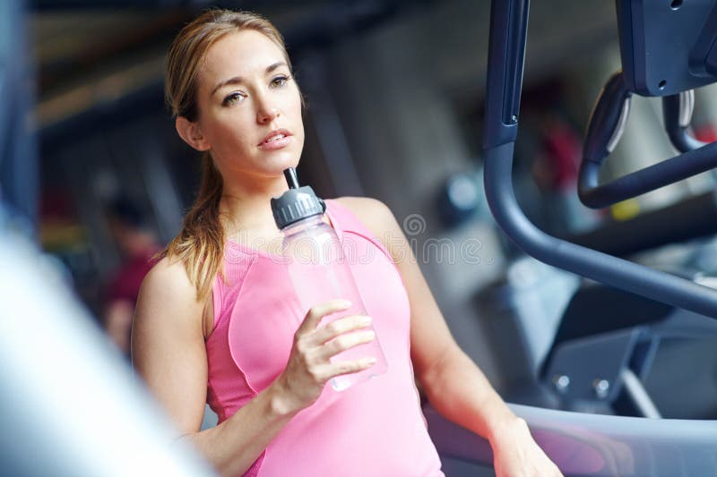 Taking a Quick Break between Workouts. a Young Woman Resting after Her ...