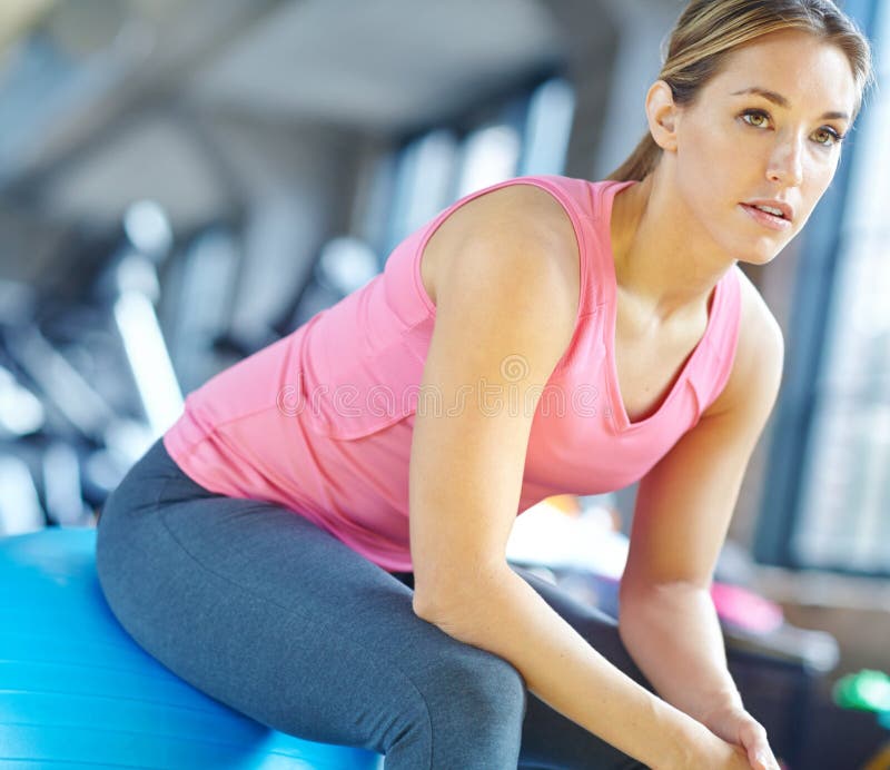 Taking a Quick Break between Workouts. a Young Woman Resting after Her ...