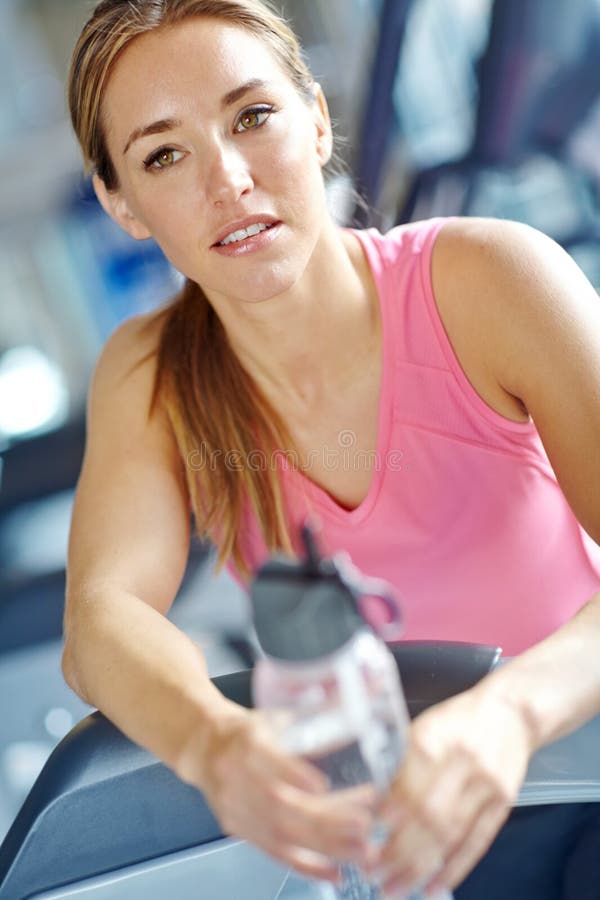 Taking a Quick Break between Workouts. a Young Woman Resting after Her Workout. Stock Photo ...
