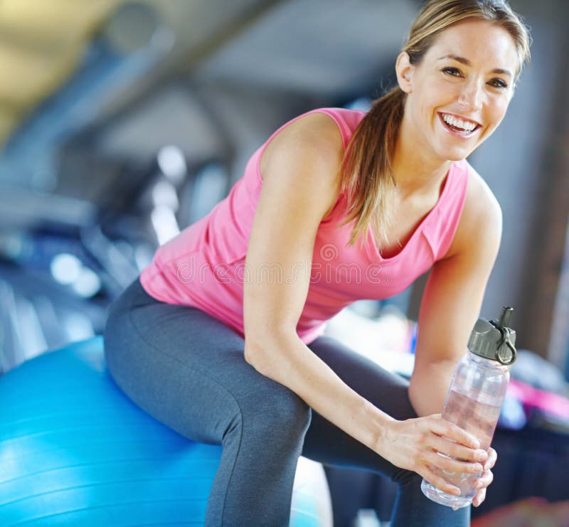 Taking a Quick Break between Workouts. a Young Woman Resting after Her ...