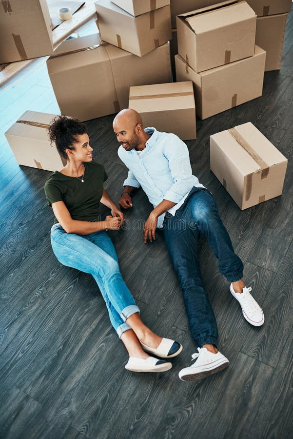 Taking a Quick Timeout during Moving. a Young Couple Taking a Break ...