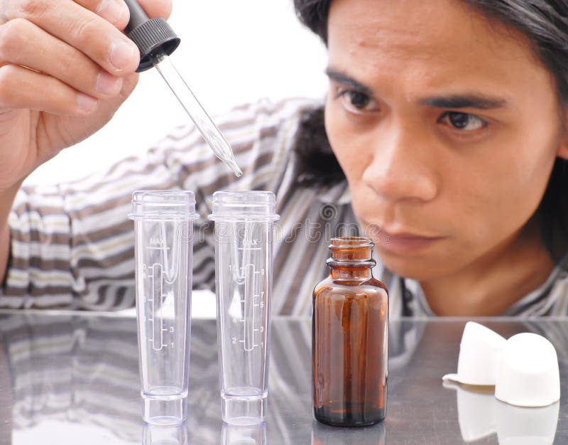 Taking a Medicine Sample stock image. Image of biotechnology - 21466533