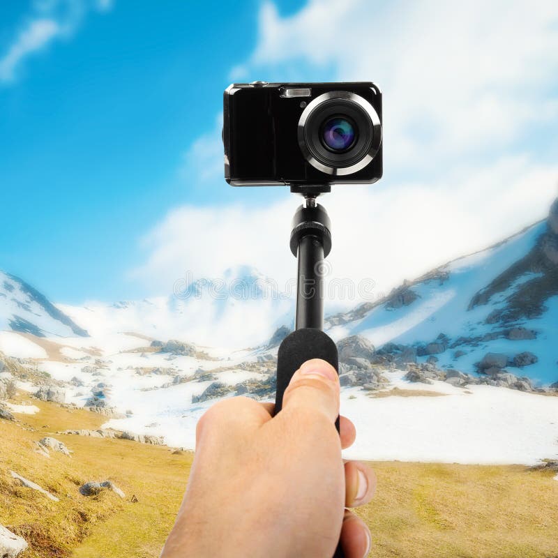 Taking Selfie - Hand with Photo Camera on Monopod Stock Photo - Image ...