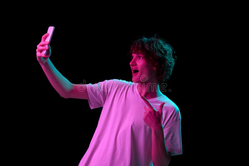 Taking Selfie. Young Handsome Boy Using Smartphone on Blackbackground ...