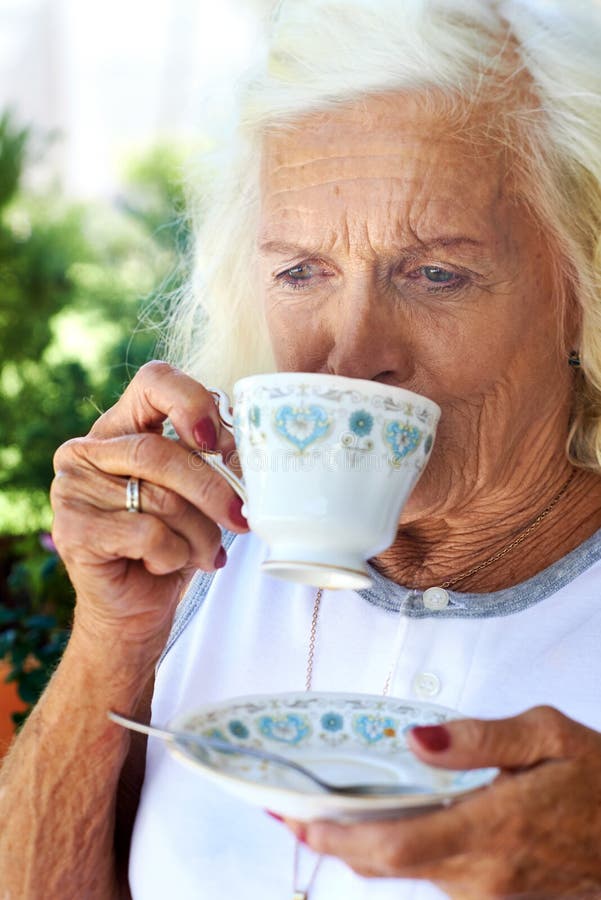 Taking a sip of tea stock photo. Image of lovely, pensioner - 41753330