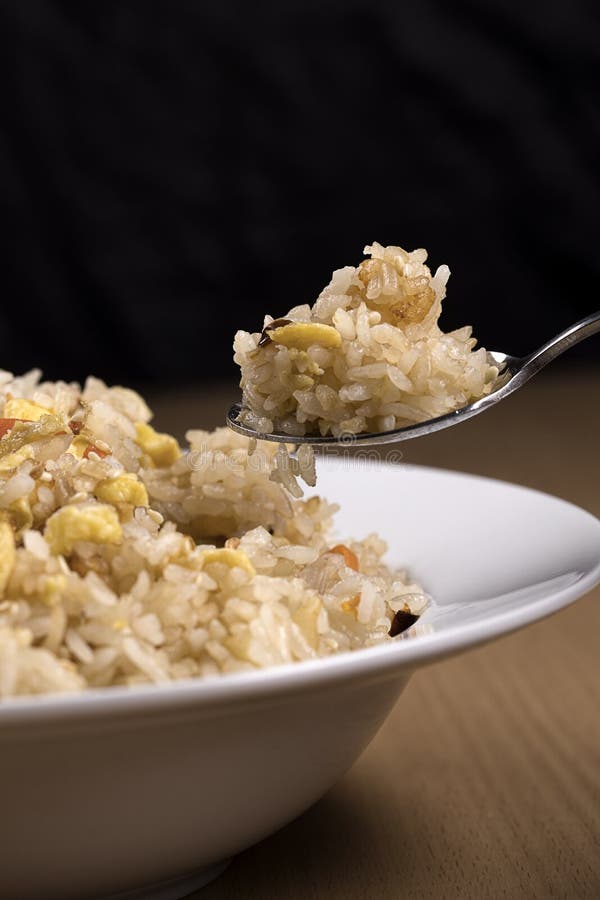 Taking a Spoonful of Fried Rice Stock Photo - Image of dinner, plate ...