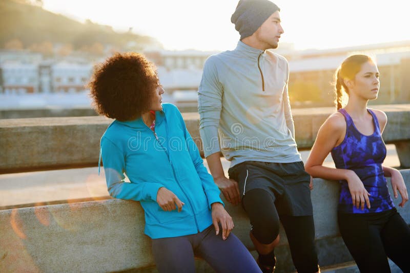 Taking in the Sunrise on a Morning Run. Three Friends Taking a Break at ...