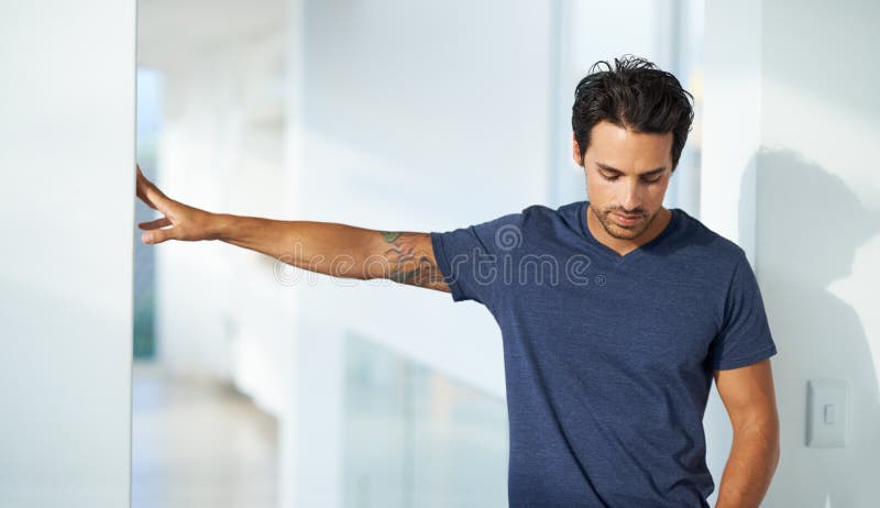 Taking Time To Thinking Things through. a Handsome Young Man Standing ...