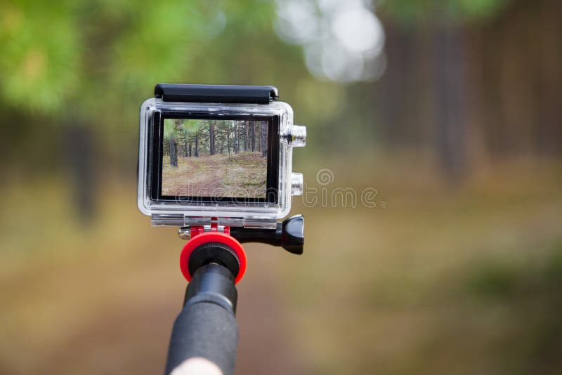 Taking Video with Action Camera on Handheld Stick Stock Image - Image ...