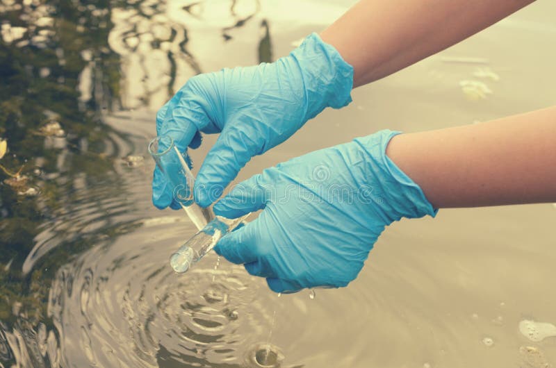 Taking a Water Test for Analysis from a Reservoir. Stock Photo - Image ...