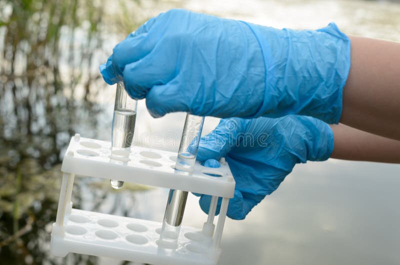 Taking a Water Test for Analysis from a Reservoir. Stock Photo - Image ...