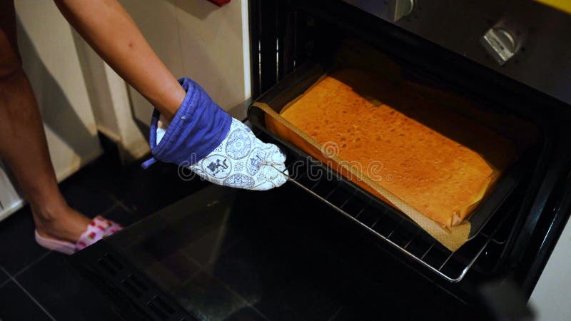 Taking a Whole Cake Out of a Hot Oven Stock Footage - Video of operate ...