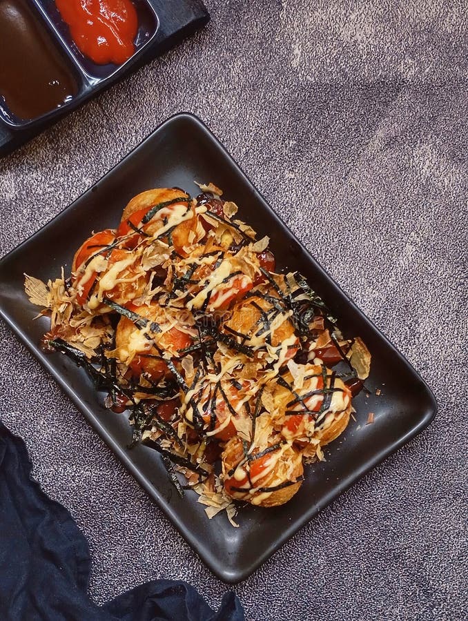 Takoyaki Japanese Snacks in Black Plate Containers Stock Photo - Image ...