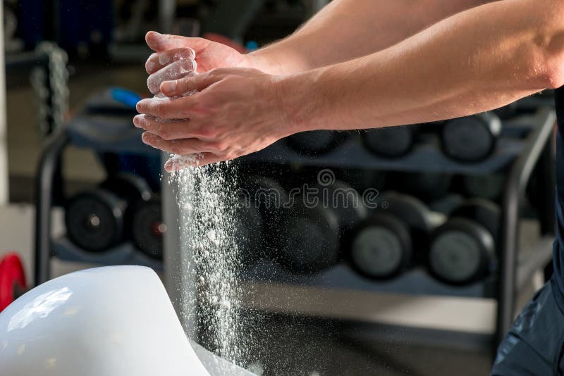 Talc in male hands in gym stock image. Image of physical - 69605557