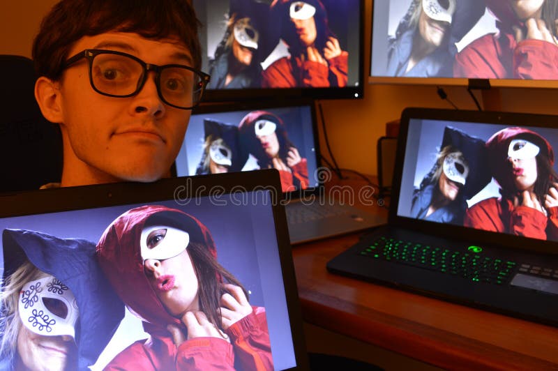 Man Working in Office with Multiple Computer Screens Stock Image ...