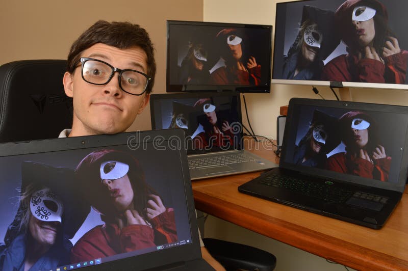 Man Working in Office with Multiple Computer Screens Stock Image ...