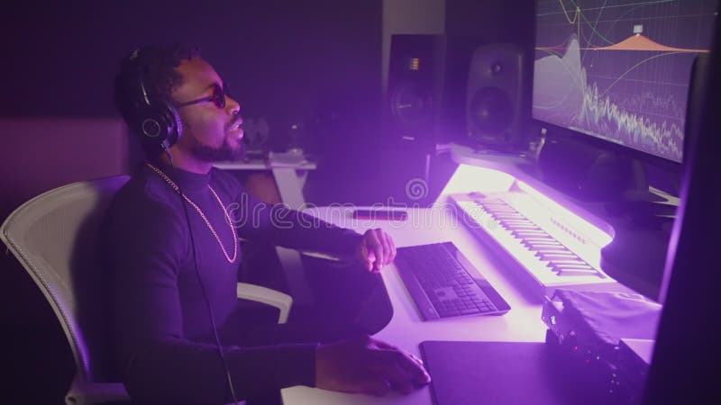 Talented African American Musician is Making Arrangements in Recording ...