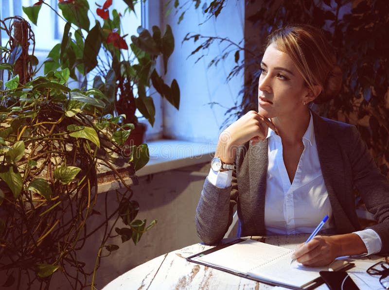 Talented Female Student Creating Article for Homework Using Textbook ...