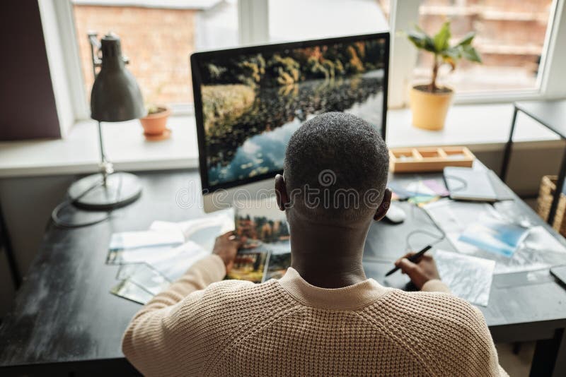 Talented Man Retouching Photos Stock Photo - Image of back ...