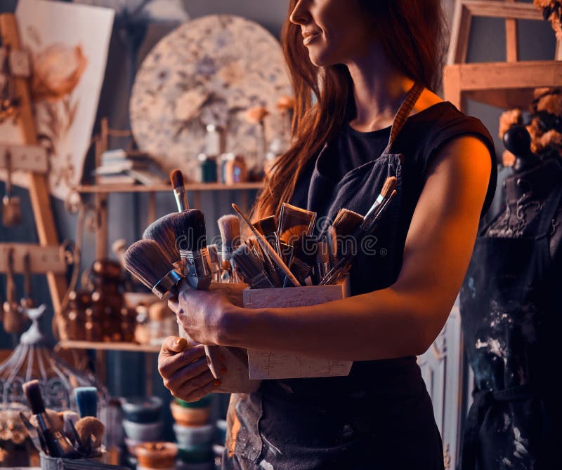 Talented Painter is Posing with Brushes in Her Own Art Studio. Stock ...