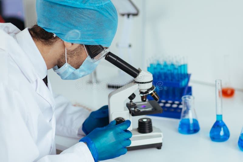 Talented Scientist Sitting at a Table in the Laboratory. Stock Photo ...