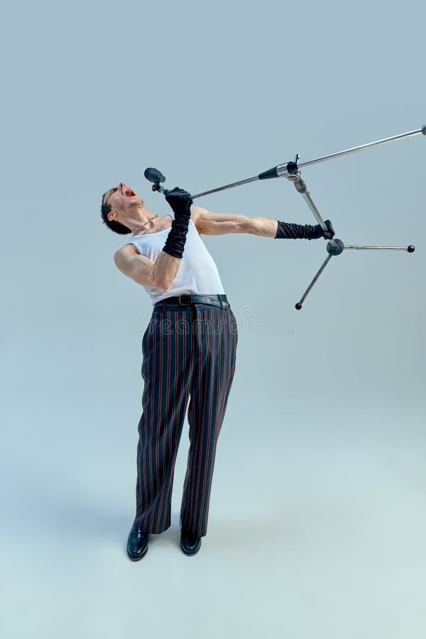 Talented Vocalist Pushing Boundaries, Microphone Stand Twisting Mid-air ...