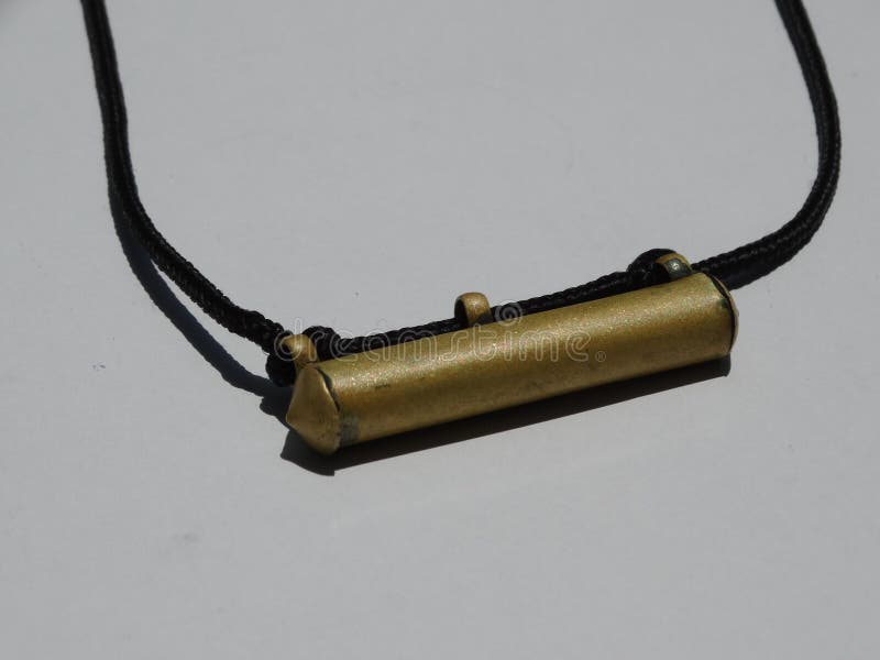 Talisman with Black String on White Stock Image - Image of silver ...