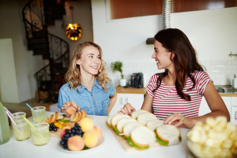 Talk in the kitchen stock photo. Image of woman, drink - 104602918