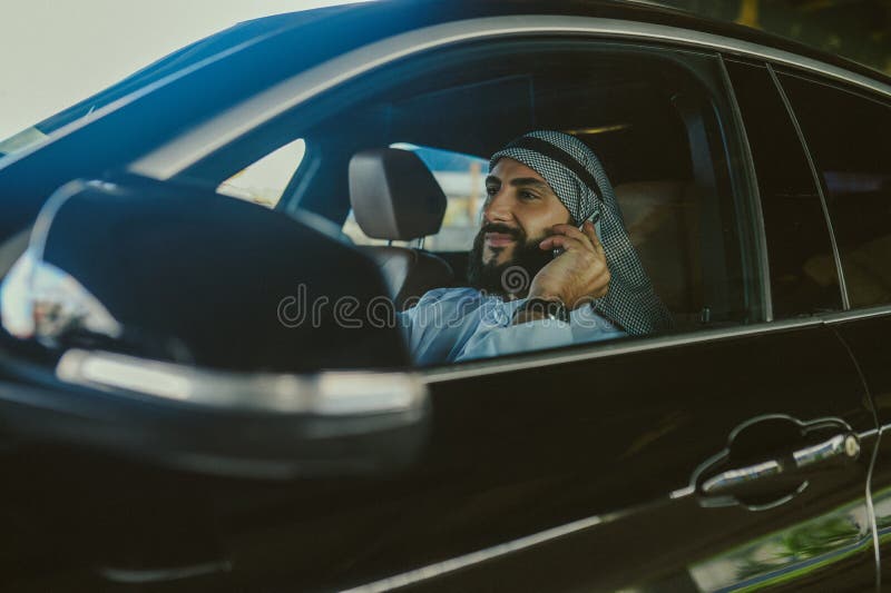 Saudi Man Sitting in a Car and Talking on the Phone Stock Photo - Image ...