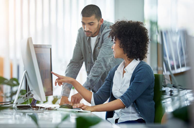 Talking Design in the Office. Two Young Designers Talking Together ...