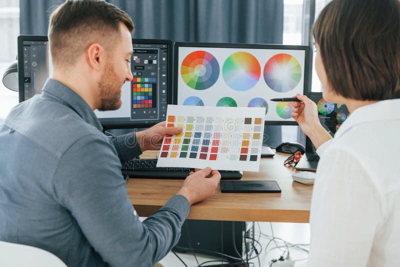 Talking with Each Other about New Ideas. Two Designers Working Together ...